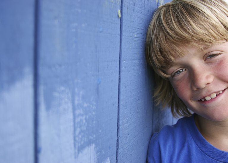 Smiling adolescent boy after therapy - Effective Child Therapy
